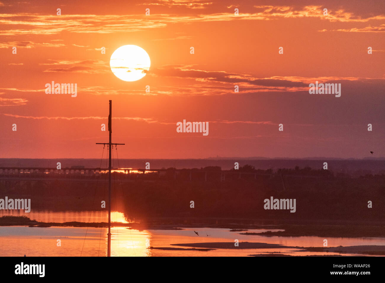 Big beautiful sunset Sun over the river. Good evening weather. Ship ...