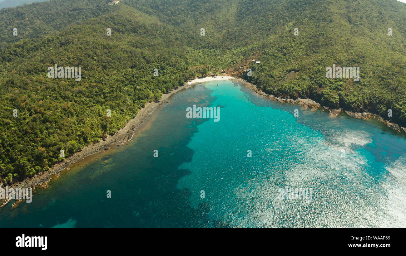 aerial view tropical sandy beach with coral reef and blue lagoon ...