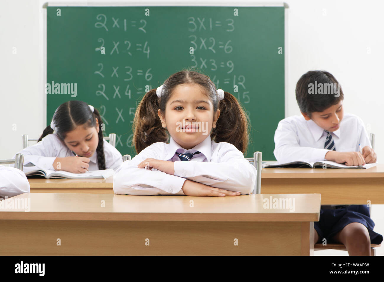 School children studying in a classroom Stock Photo - Alamy