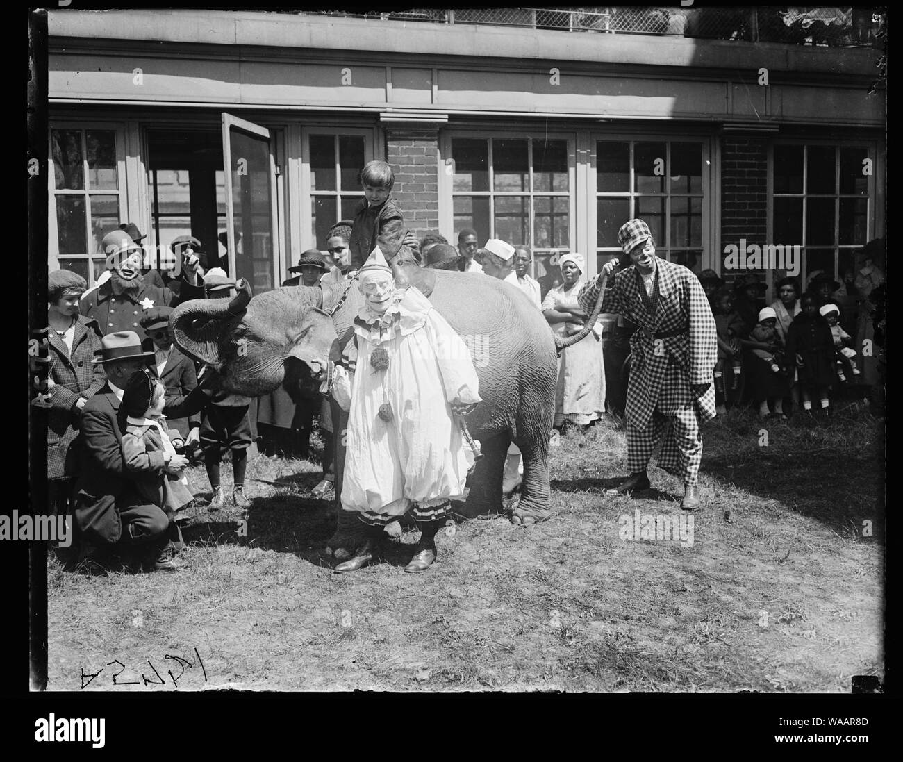 Clowns perform for sick and crippled at Children's Hospital Stock Photo ...