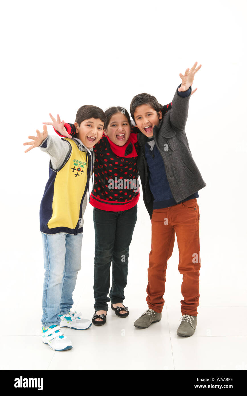 Three friends standing together and enjoying Stock Photo - Alamy