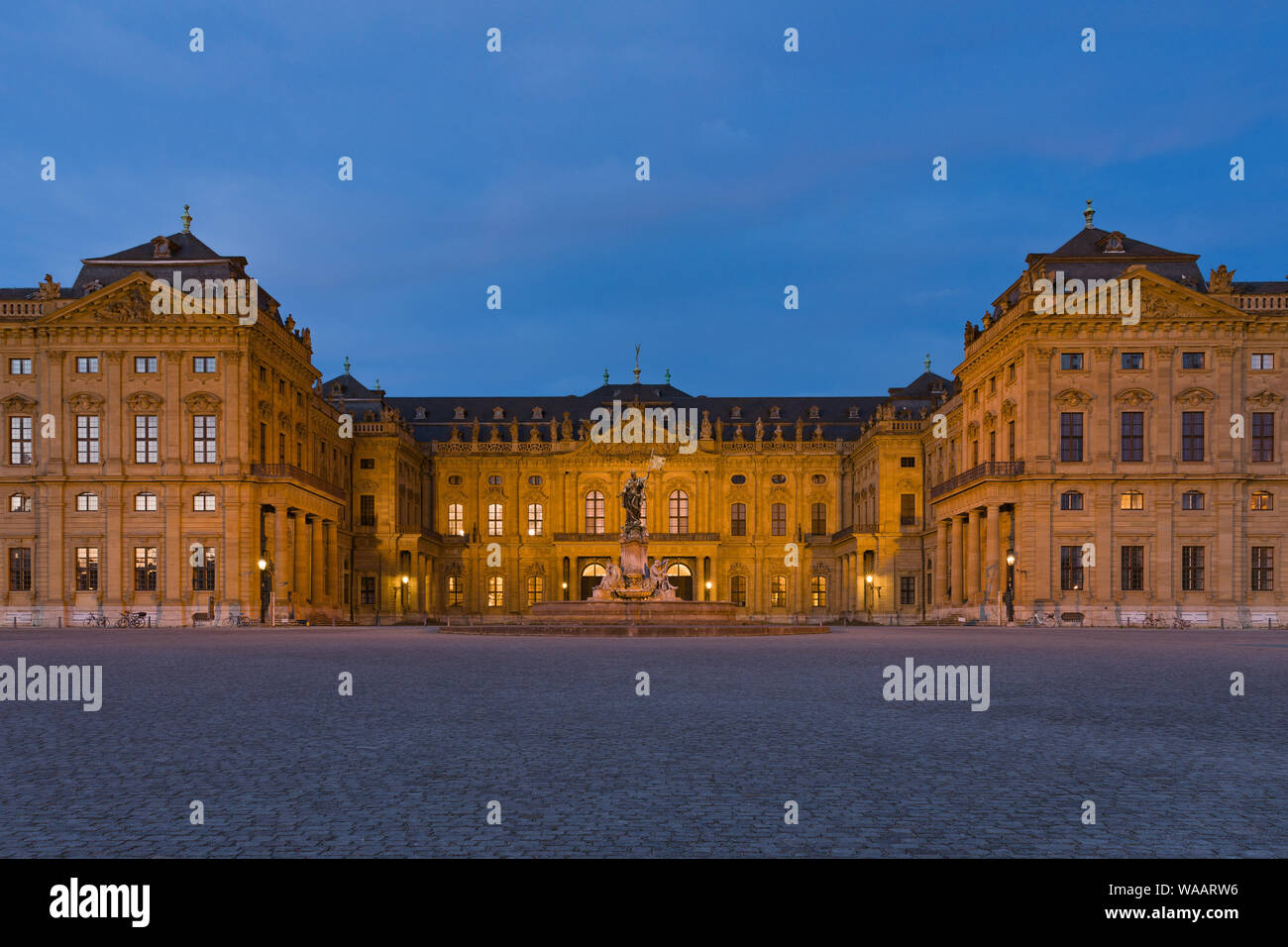 The Residenz of Wuerzburg with fountain at blue hour, Germany Stock ...