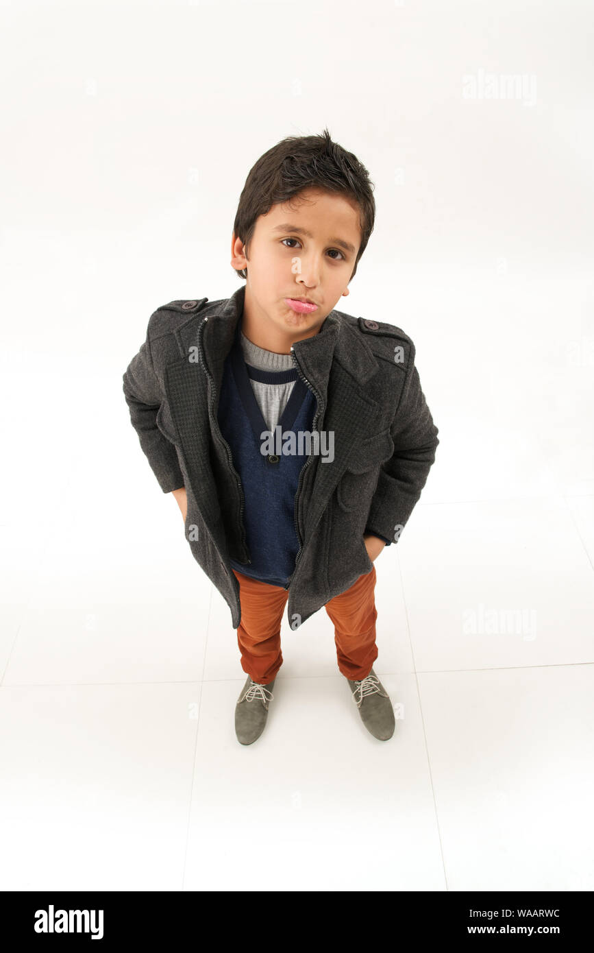 High angle view of a boy grimacing towards camera Stock Photo - Alamy