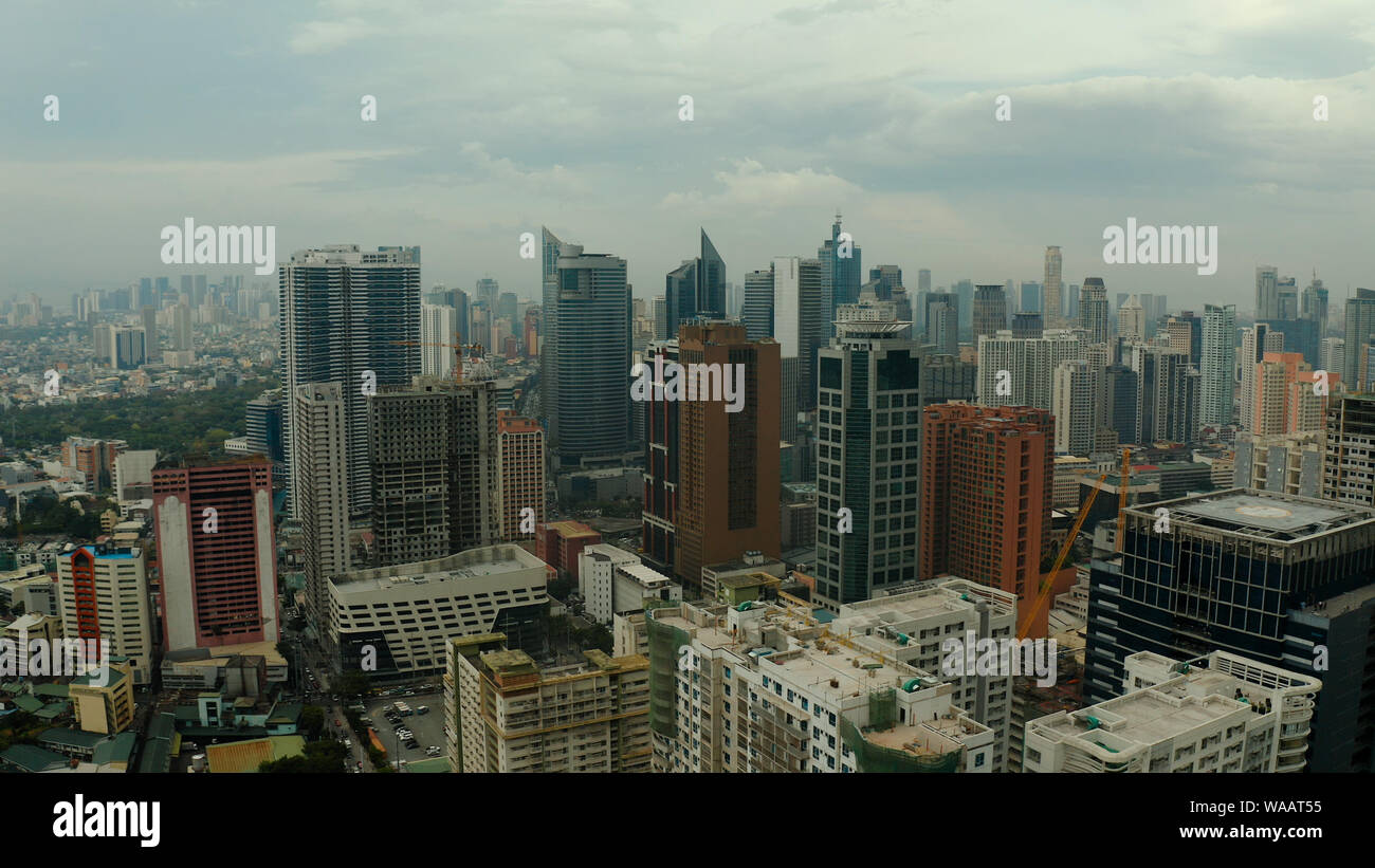 Manila city with skyscrapers, modern buildings and Makati business ...