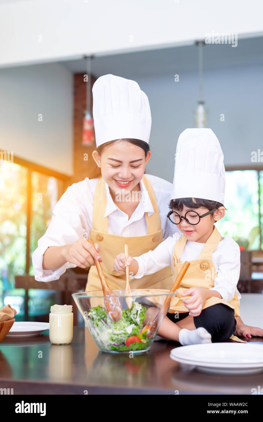 Asian mom teaching her son to cook hi-res stock photography and images ...