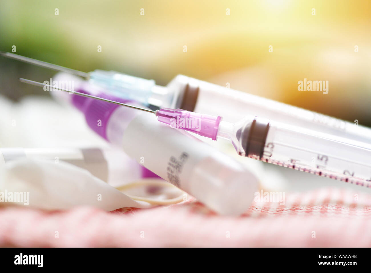 Medicine bottles and syringe injection needle on white background ...