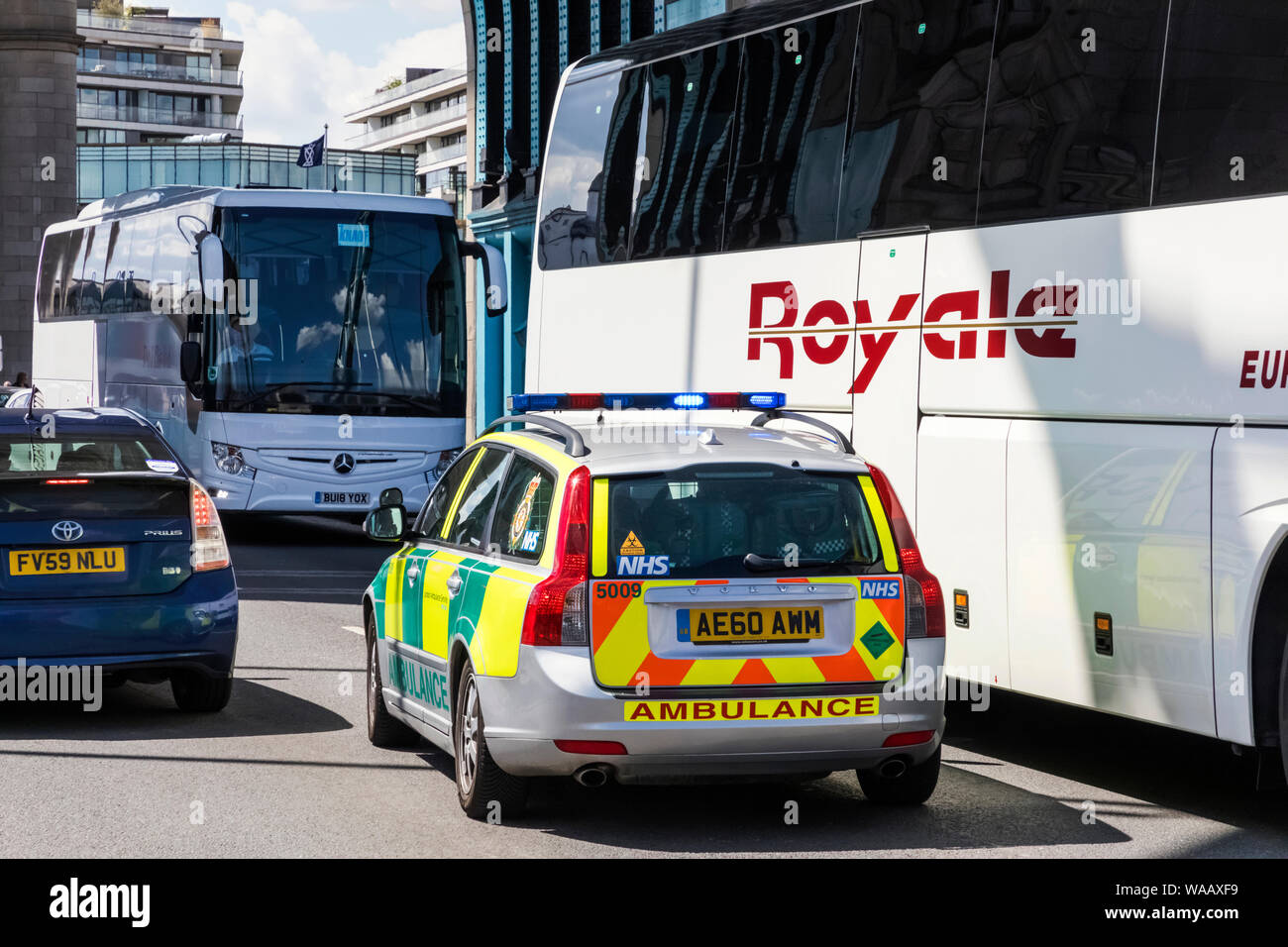 England, London, NHS Ambulance Car and Traffic on Tower Bridge ...