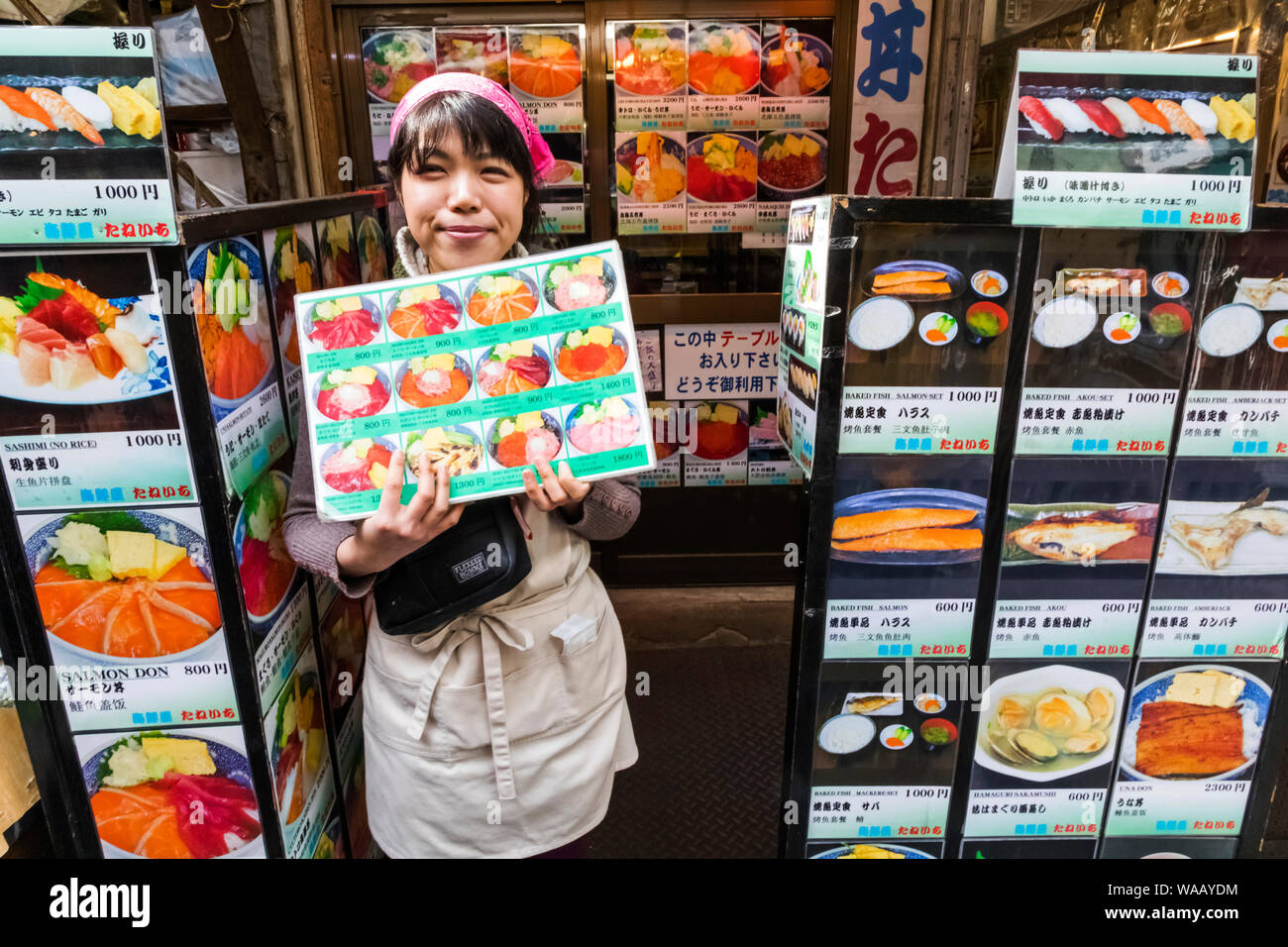 Japan, Honshu, Tokyo, Tsukiji Market, Fish Restaurant Waitress Holding ...