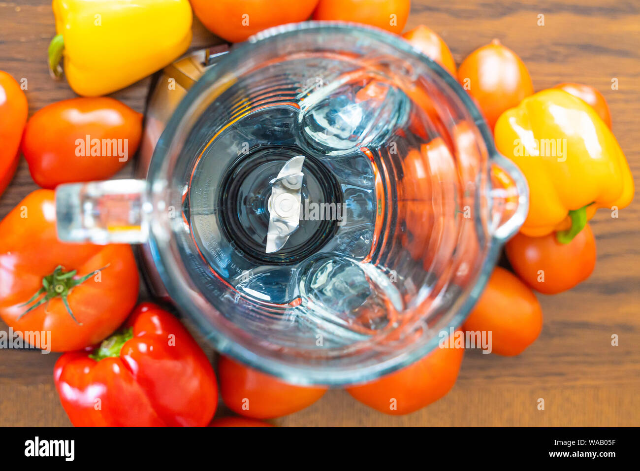 Tomatoes and Bell peppers with Blender in kitchen Stock Photo - Alamy