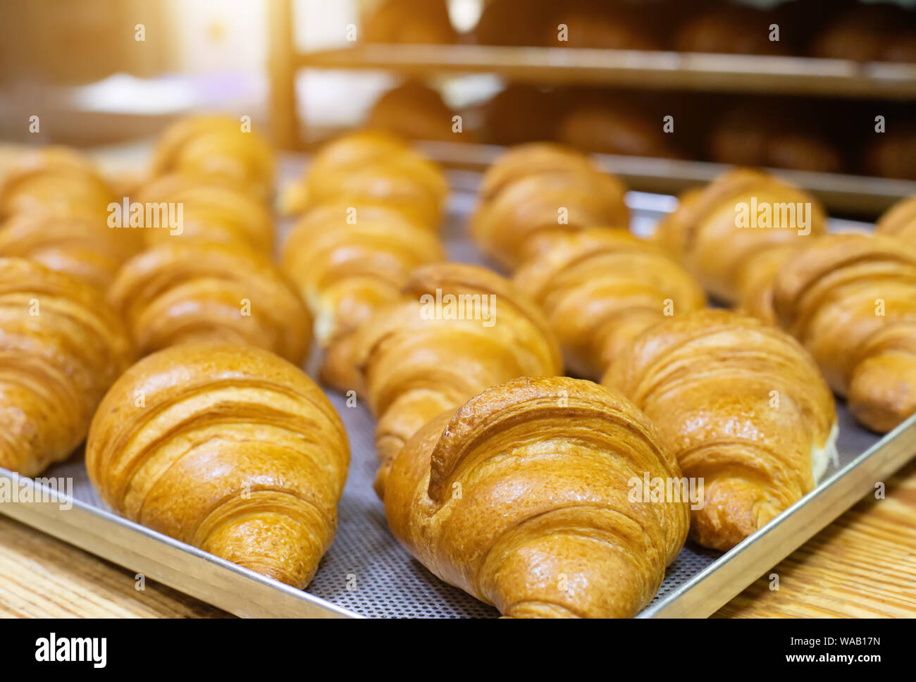 Fresh golden croissants with filling, background. Pastry confectionery ...