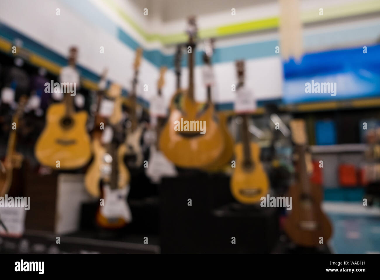 Blur Abstract Background Guitars in music shop Stock Photo - Alamy