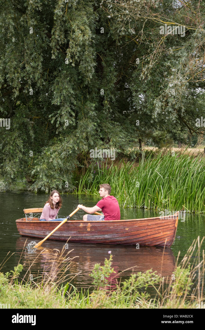 Visitors to Flatford Mill hire rowing boats to explore the River Stour ...