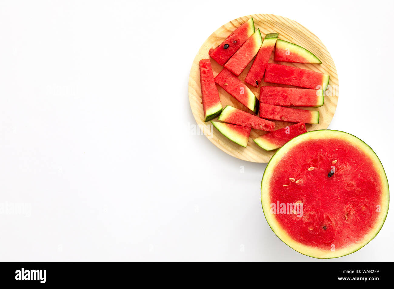 Watermelon cut in half and slices isolated in white background with ...