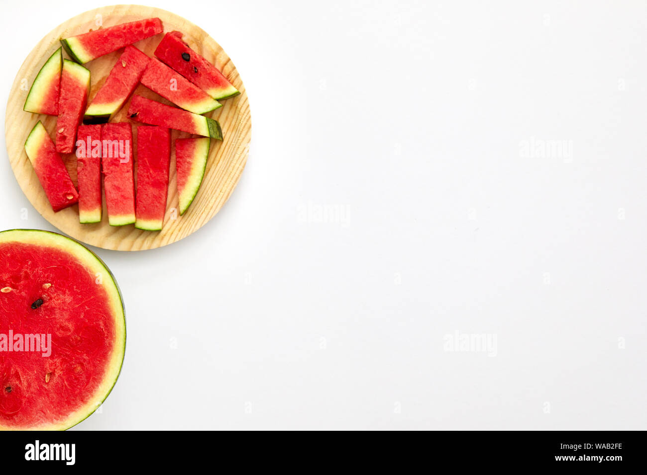 Watermelon cut in half and slices isolated in white background with ...