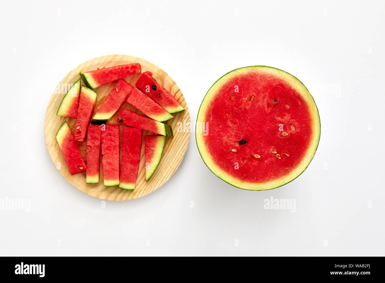 Watermelon cut in half and slices isolated in white background with ...