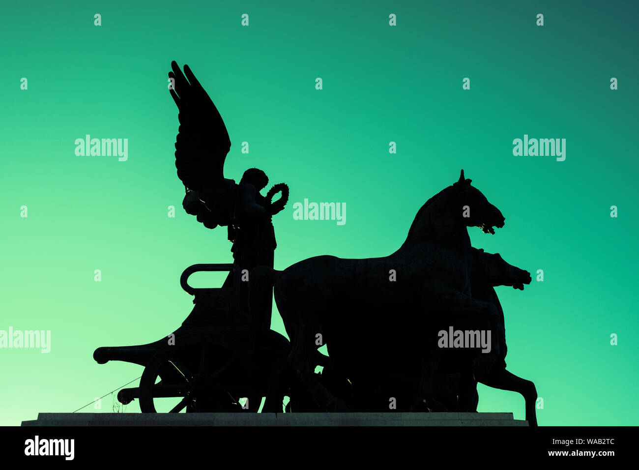 The Goddess of Victory monument with a green background on top of the ...