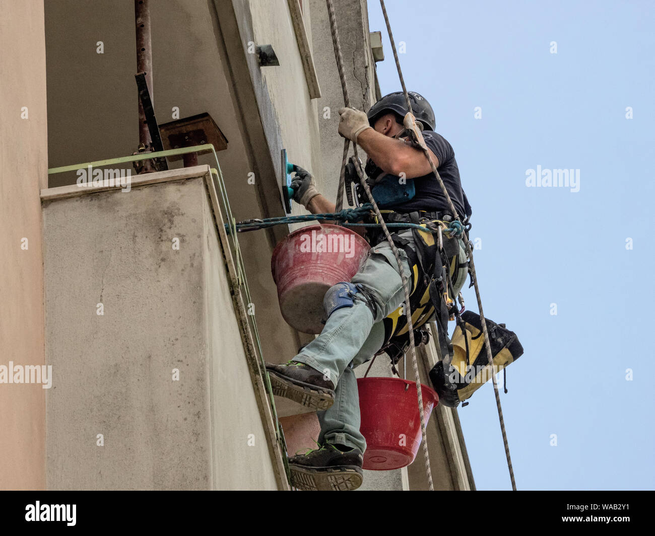 masonry work without scaffolding in an old building Stock Photo - Alamy