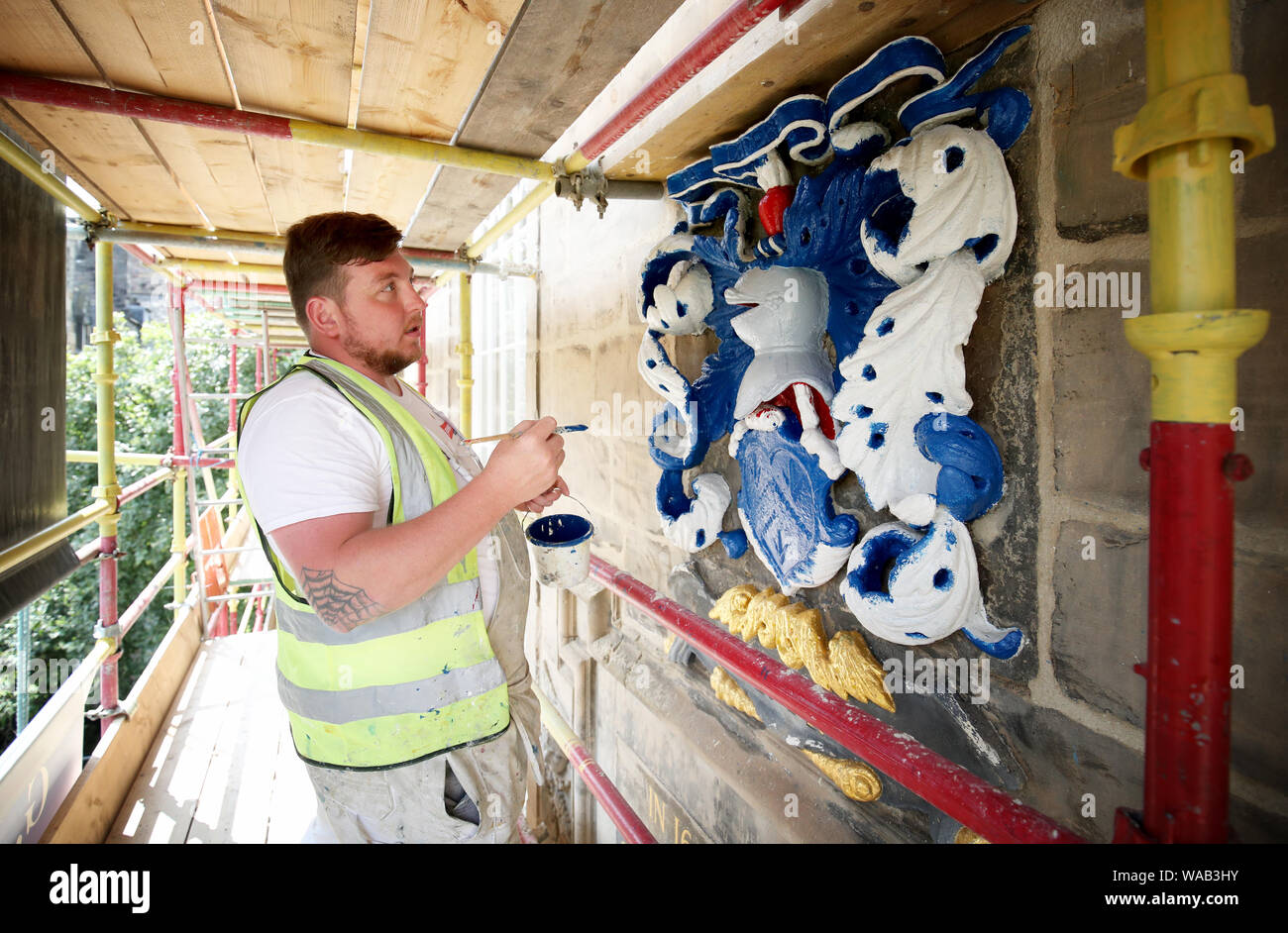 Colin Morris, from Nevin of Edinburgh Painters, paints one of the royal ...