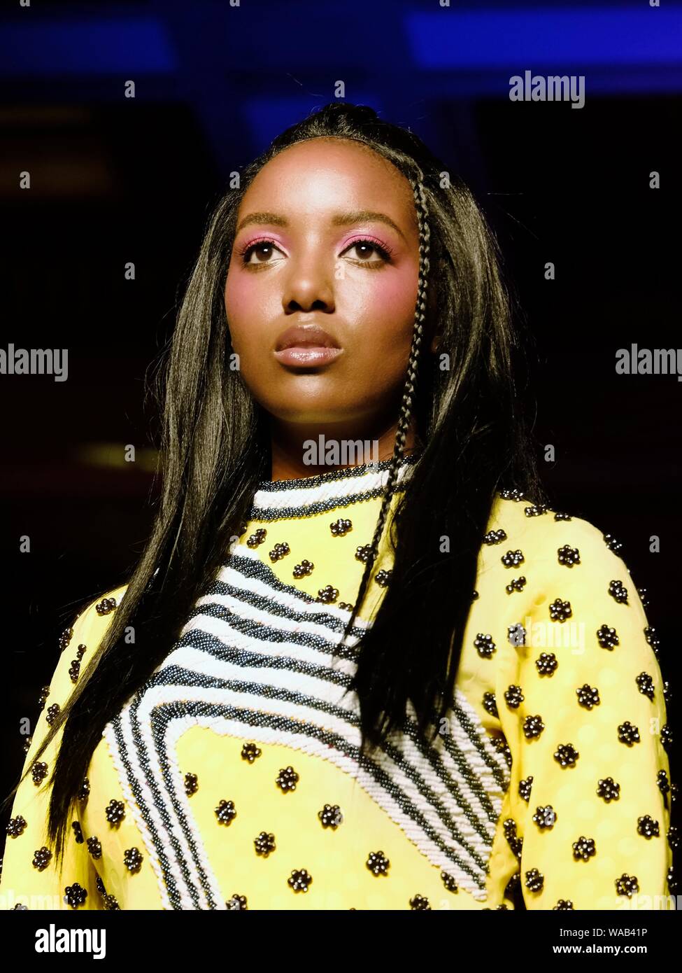 Designer Muhire showcases work on the catwalk at the Africa Fashion ...