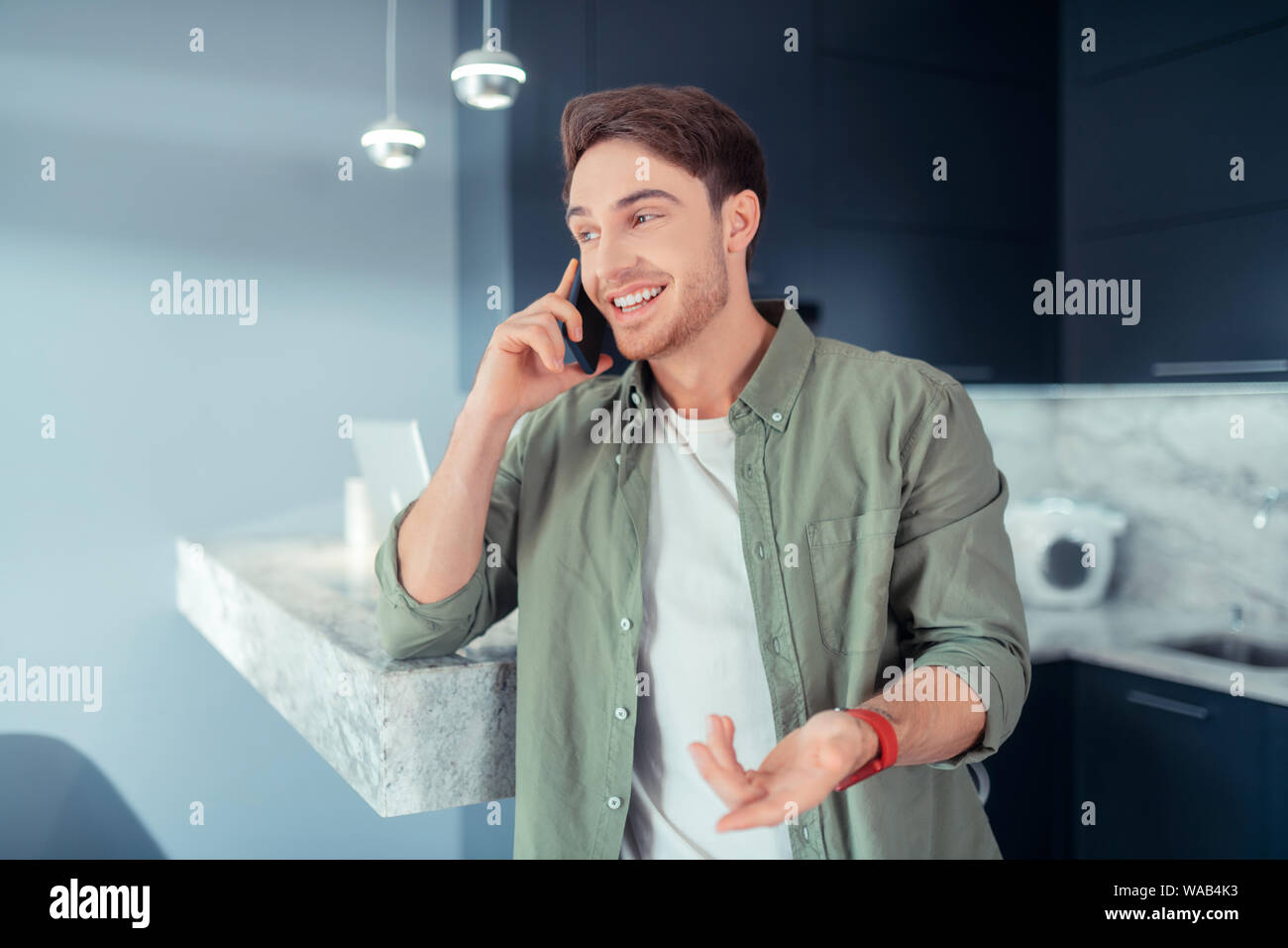 Handsome man calling his girlfriend in the morning Stock Photo - Alamy