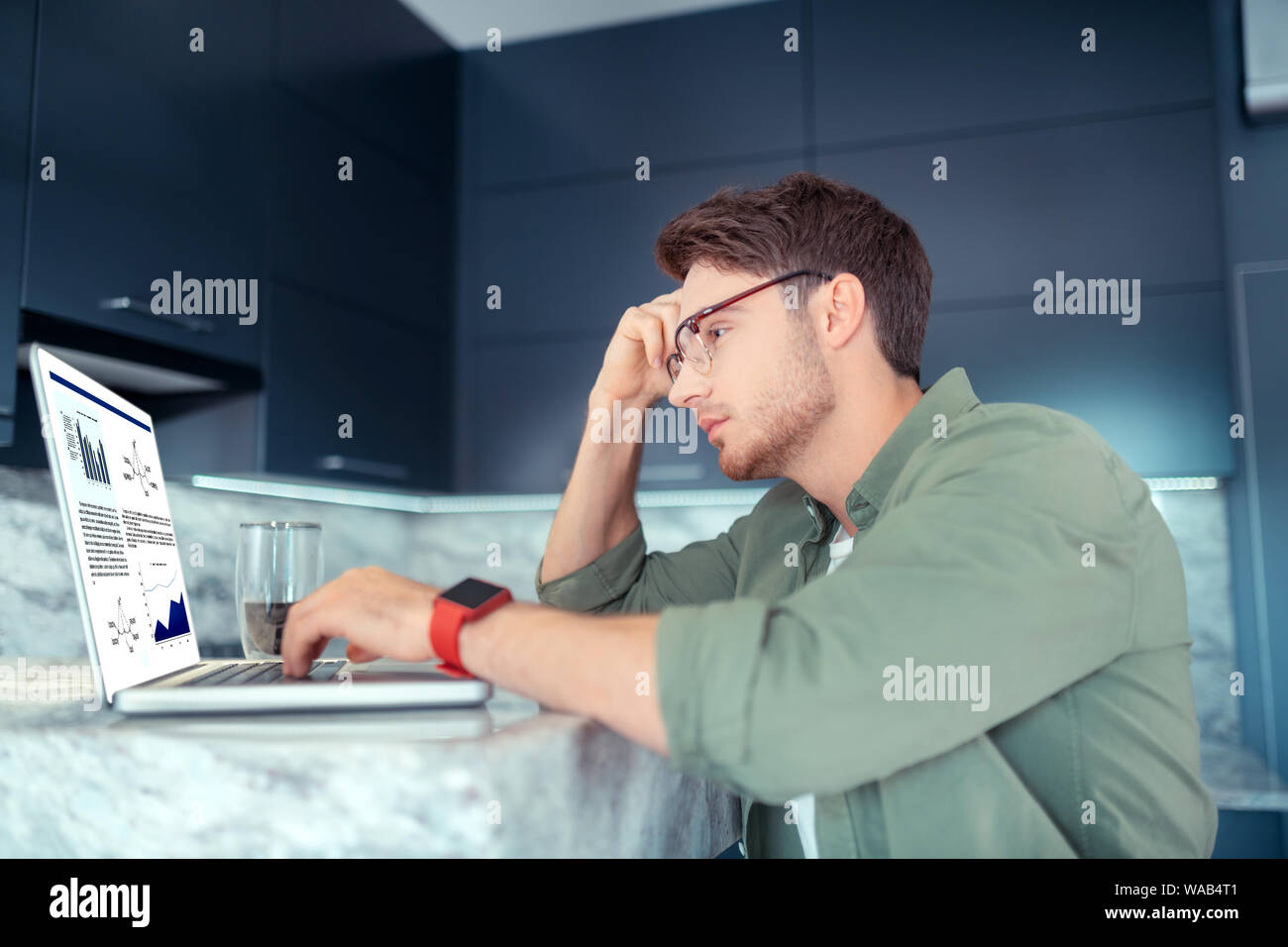 Man feeling overloaded while working from home Stock Photo - Alamy