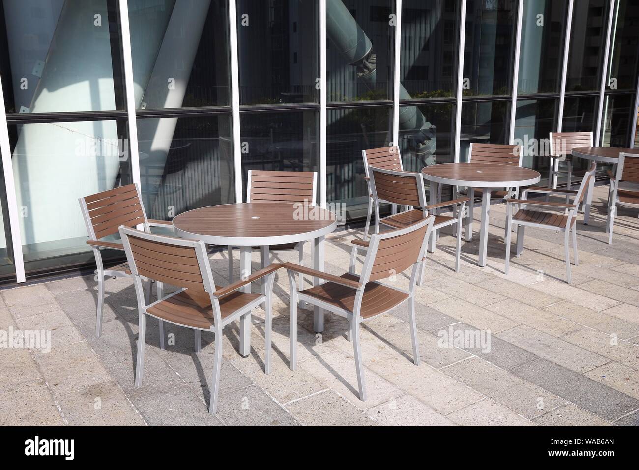 Generic modern outdoor cafe in Tokyo, Japan. Simple chairs and tables ...