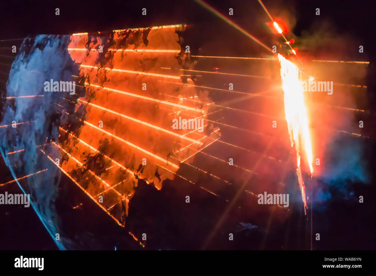 Abstract background pattern with space bright colorful orange laser ...