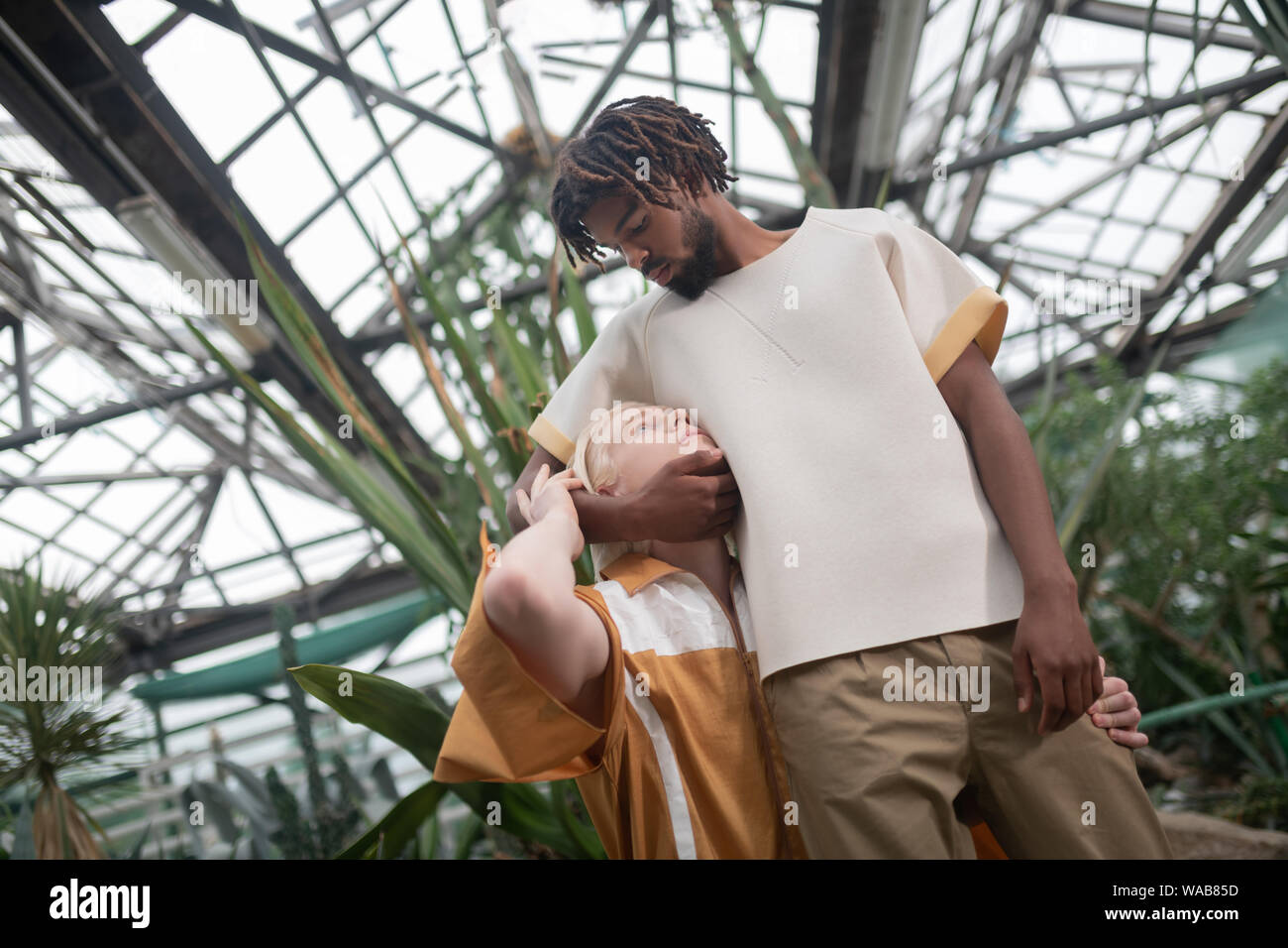 Two male models participating in photo session together Stock Photo - Alamy