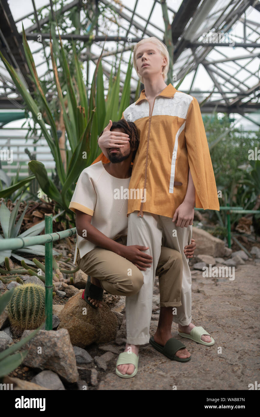 Male models wearing stylish clothing posing for photographer Stock ...