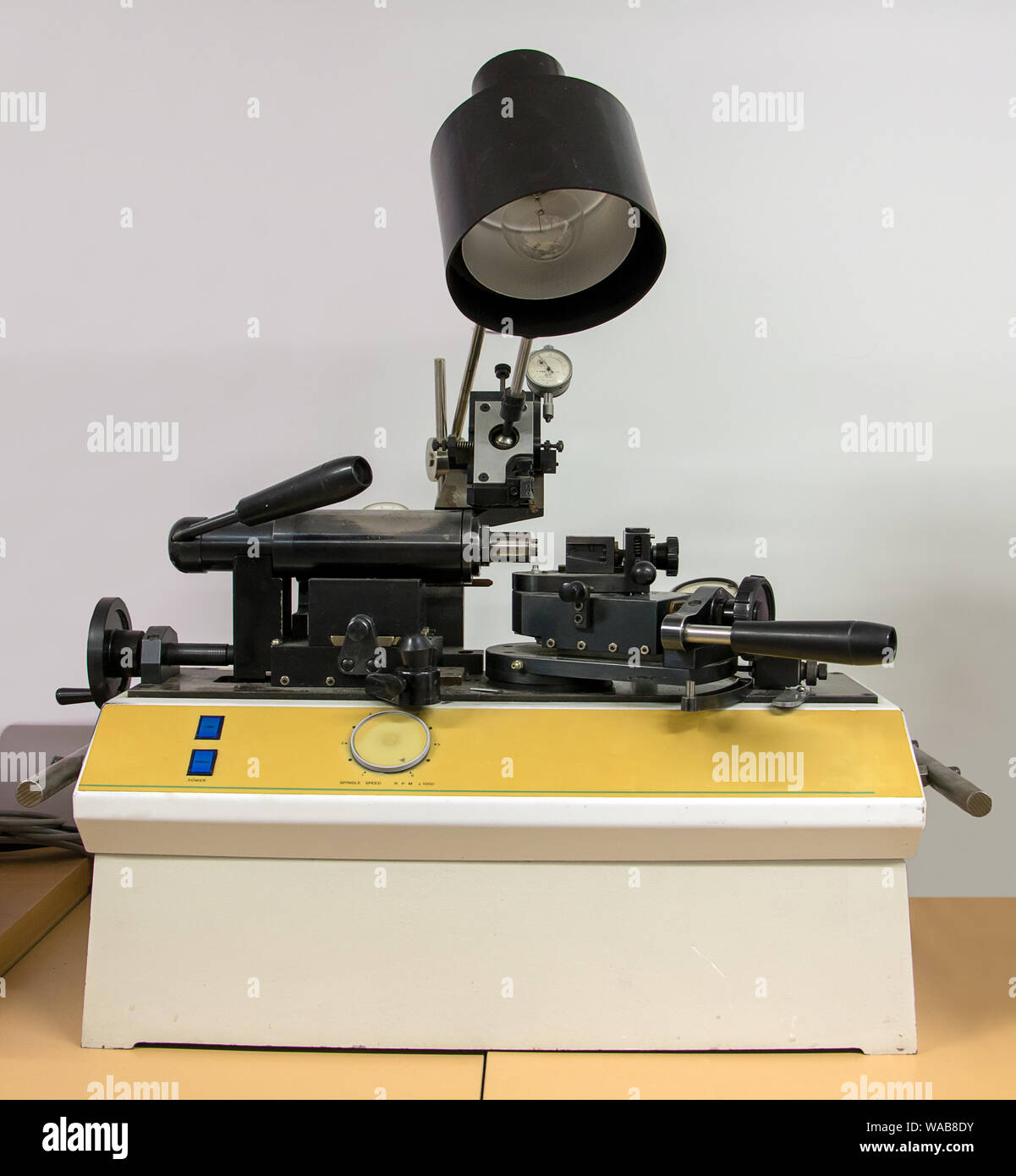 Manually operated lathe for making contact lenses Stock Photo - Alamy