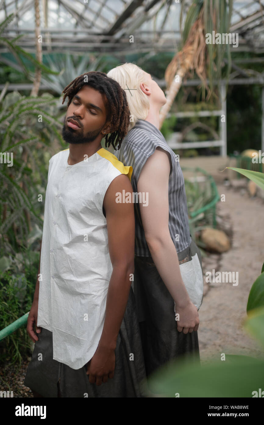 Top view of two male models standing back to back Stock Photo - Alamy