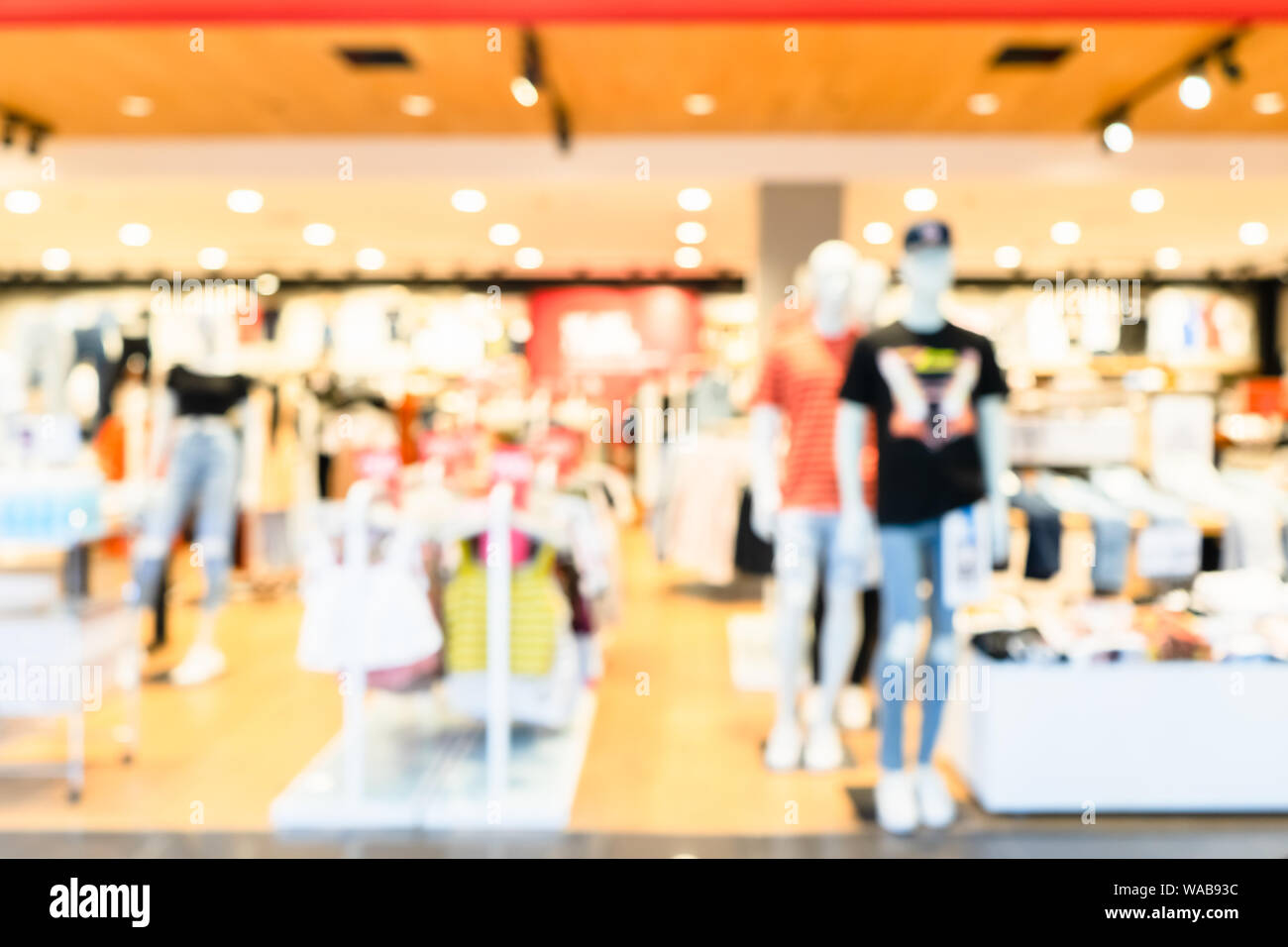 Blurred image of a dress store dressed mannequins for fashion ...