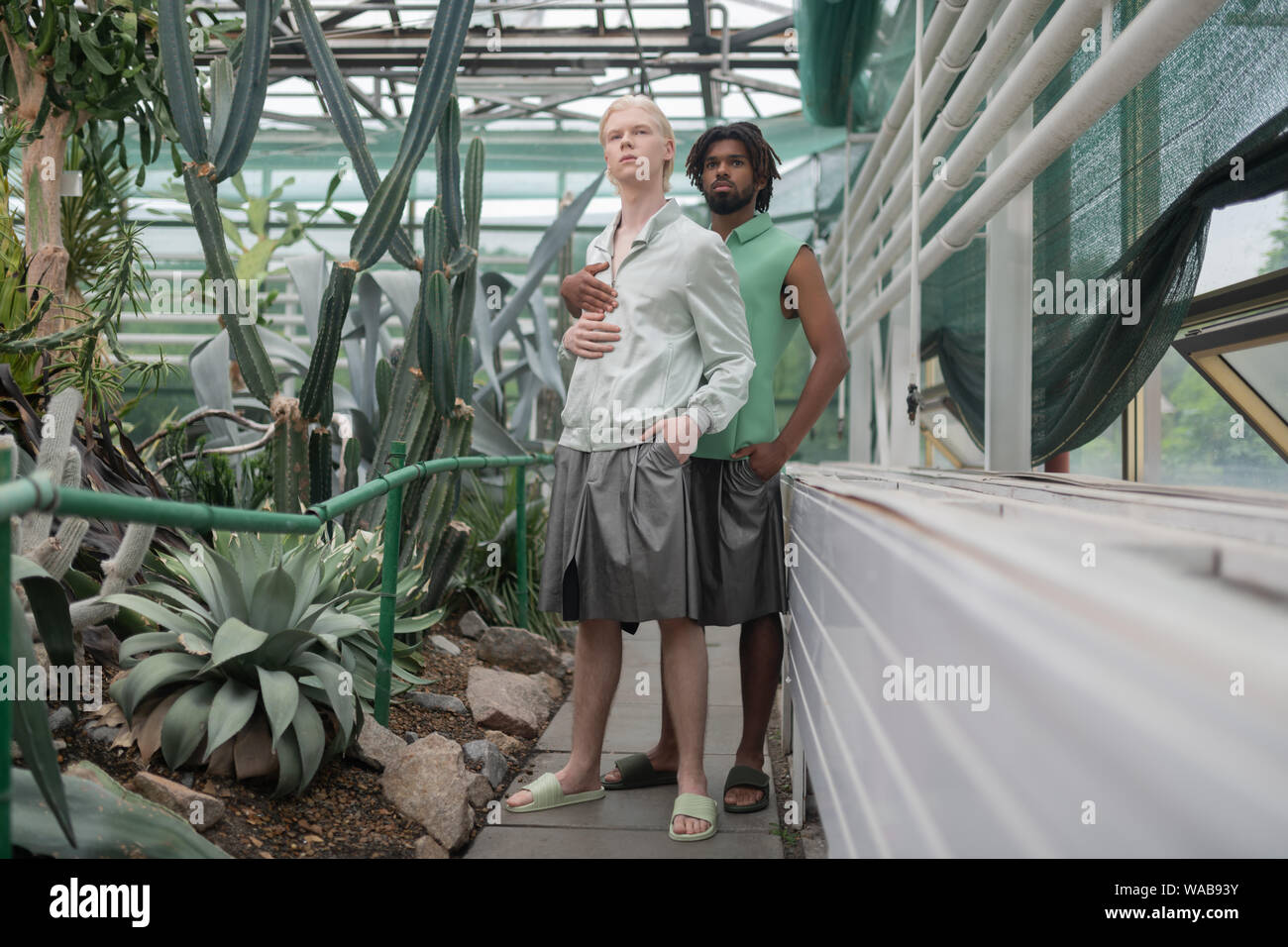 Two young male models promoting summer collection Stock Photo - Alamy