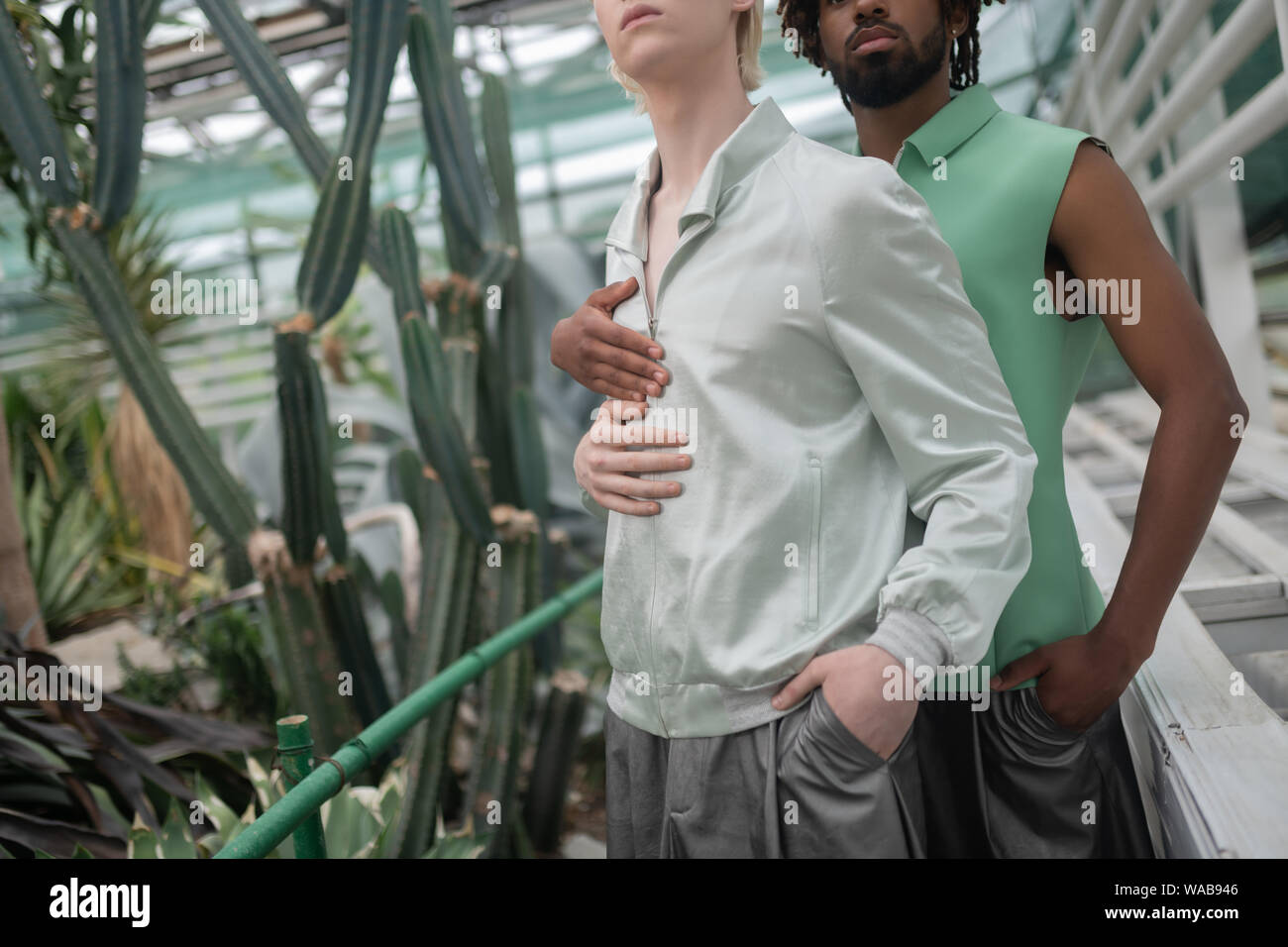 Two models hugging while promoting summer clothing Stock Photo - Alamy