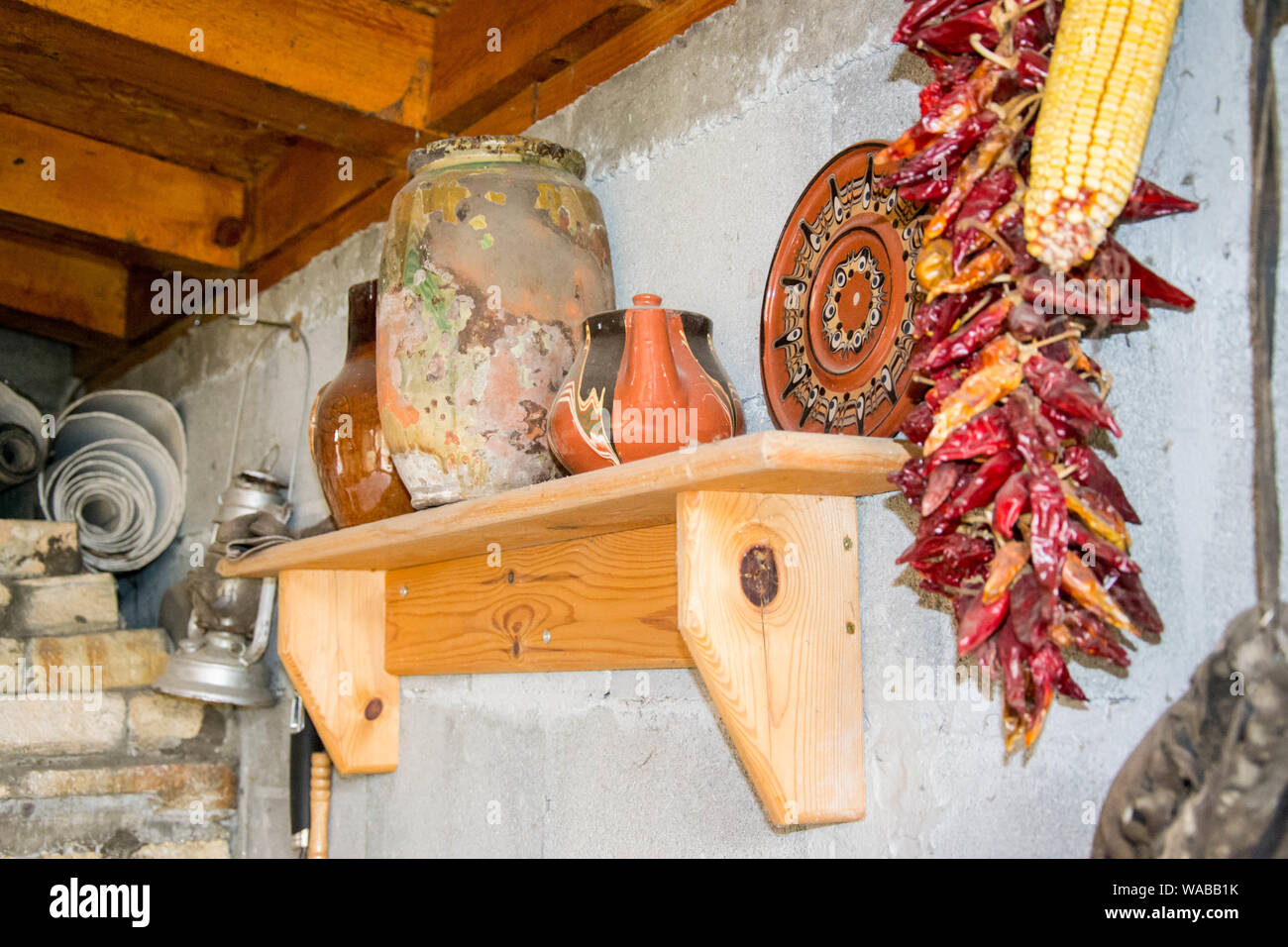 Traditional old bulgarian objects - dried pepper, corn, clay pots ...