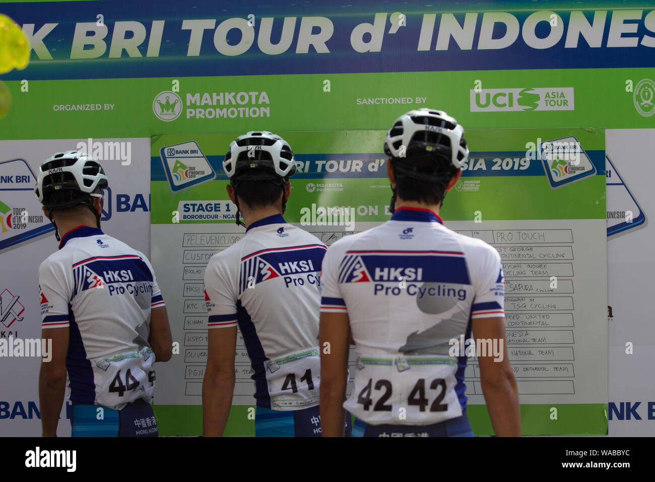Cyclists sign in before the race at first stage of Tour de Indonesia ...