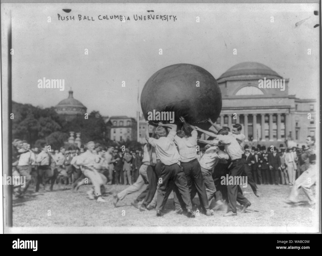 Columbia University- Push-Ball. Male students holding up huge ball ...