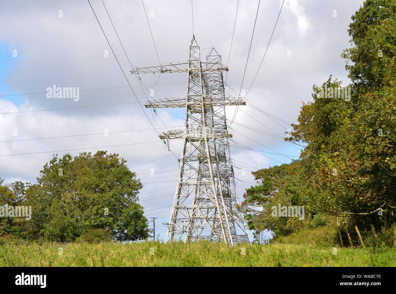 high Voltage electricity power lines in country side Stock Photo - Alamy