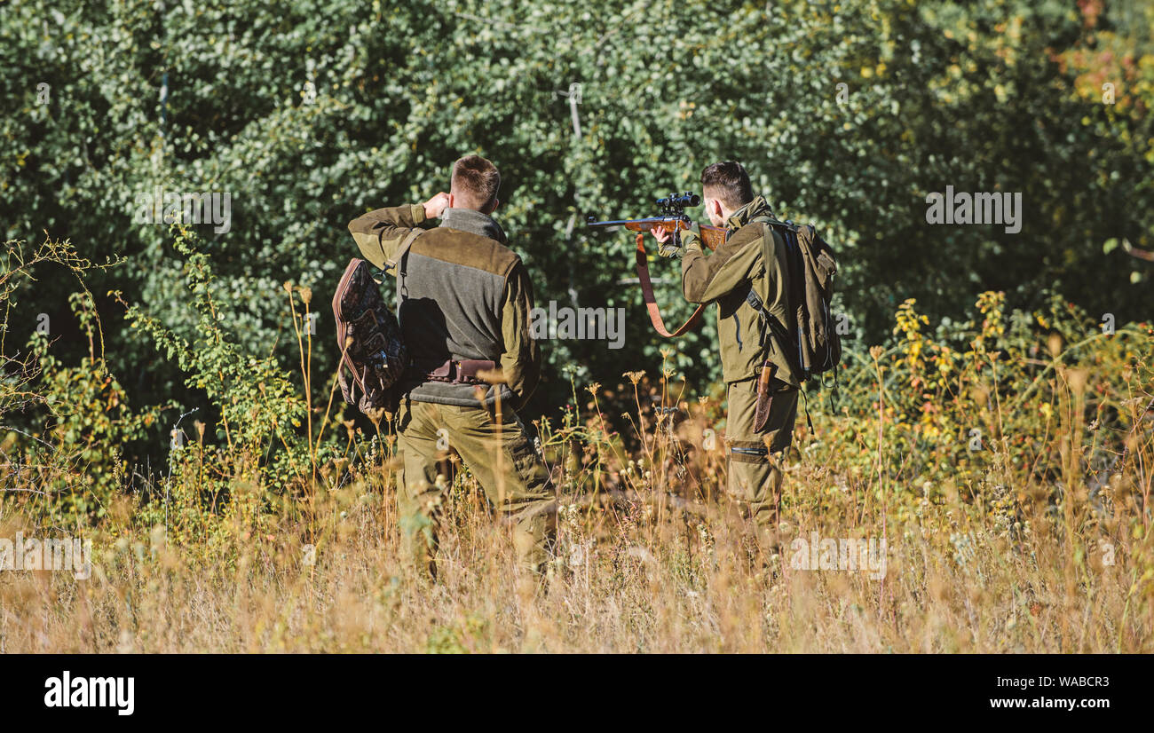 Hunting with friends. Hunters friends enjoy leisure. Teamwork and ...