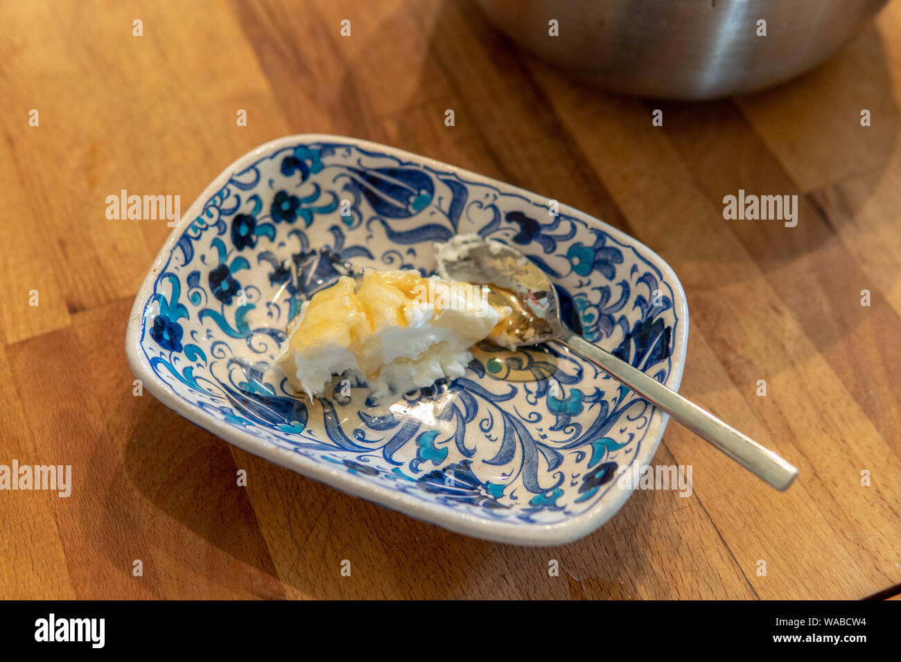 Traditional turkish cheese tipped with natural honey Stock Photo - Alamy