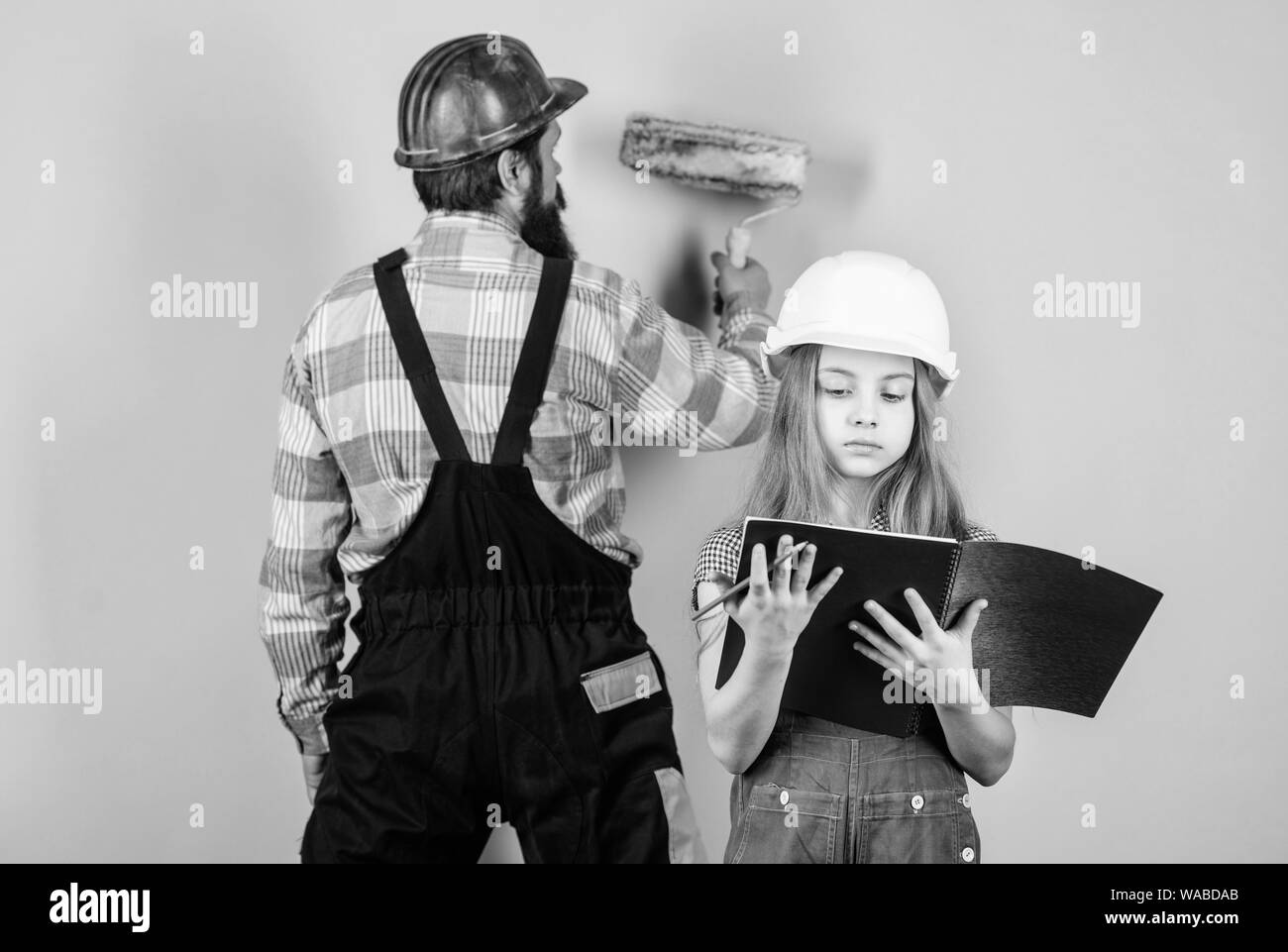 daughter and father repairing together in workshop. Family. Industry ...