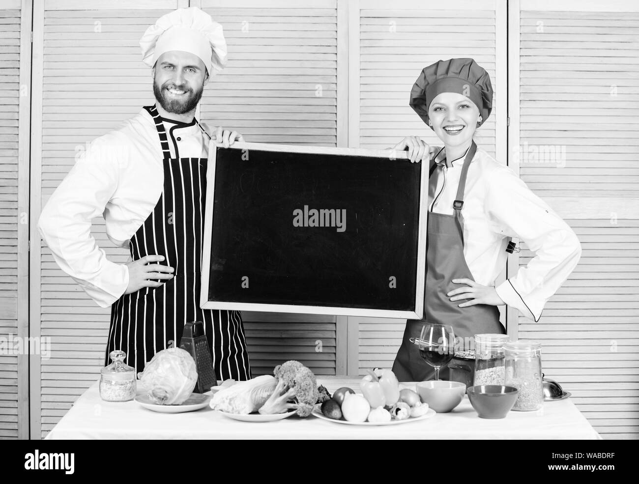 Making good food. Chef and cook helper teaching master class. Couple of ...