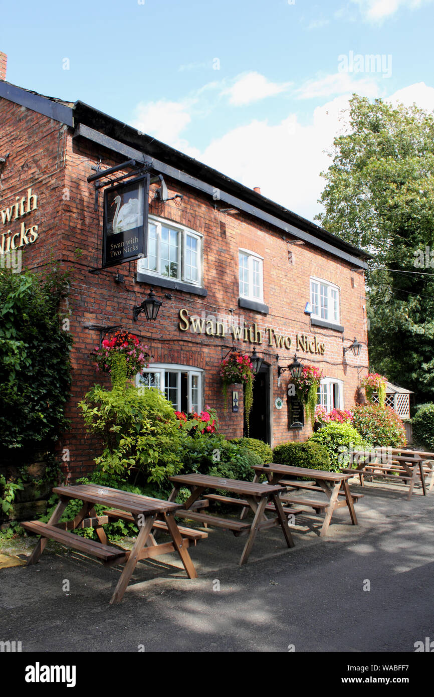 View of English country pub, the Swan with Two Nicks Stock Photo - Alamy