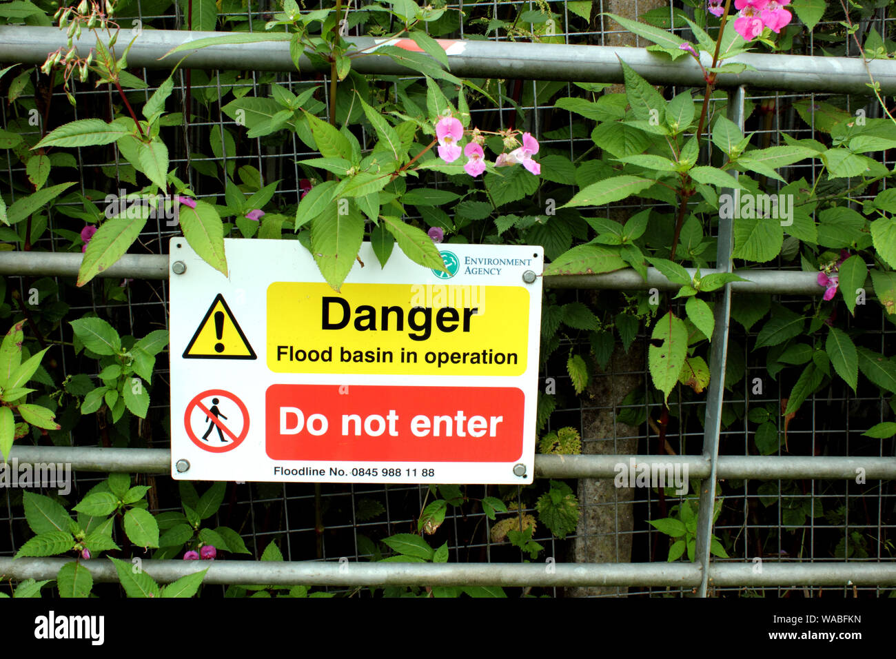 Sign warning of flood risk Stock Photo - Alamy