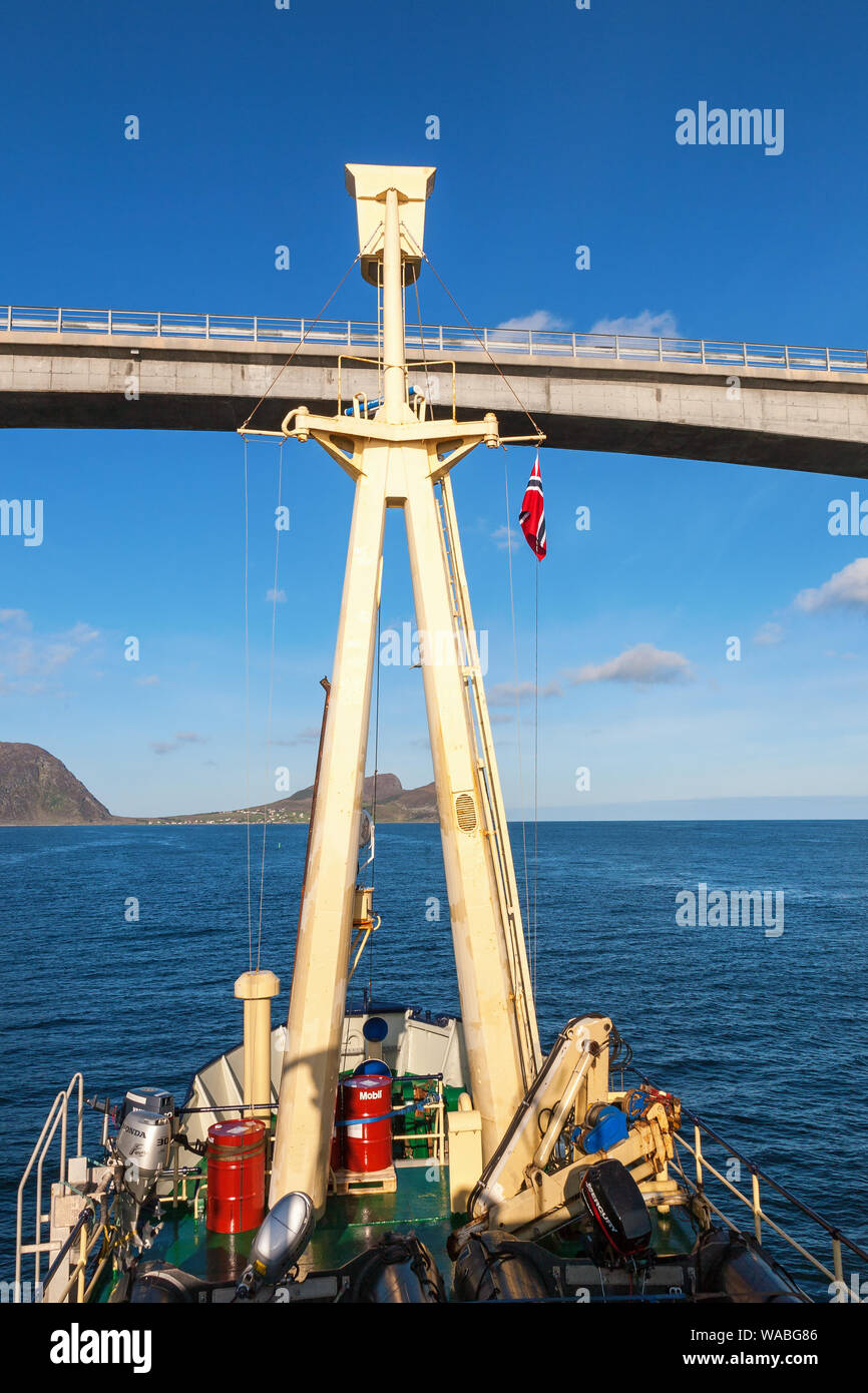 Vessel going under a bridge to the sea Stock Photo - Alamy