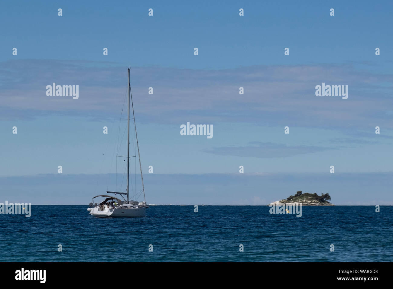 Yacht moving in sea near small island, Rovinj, Istria, Croatia Stock ...