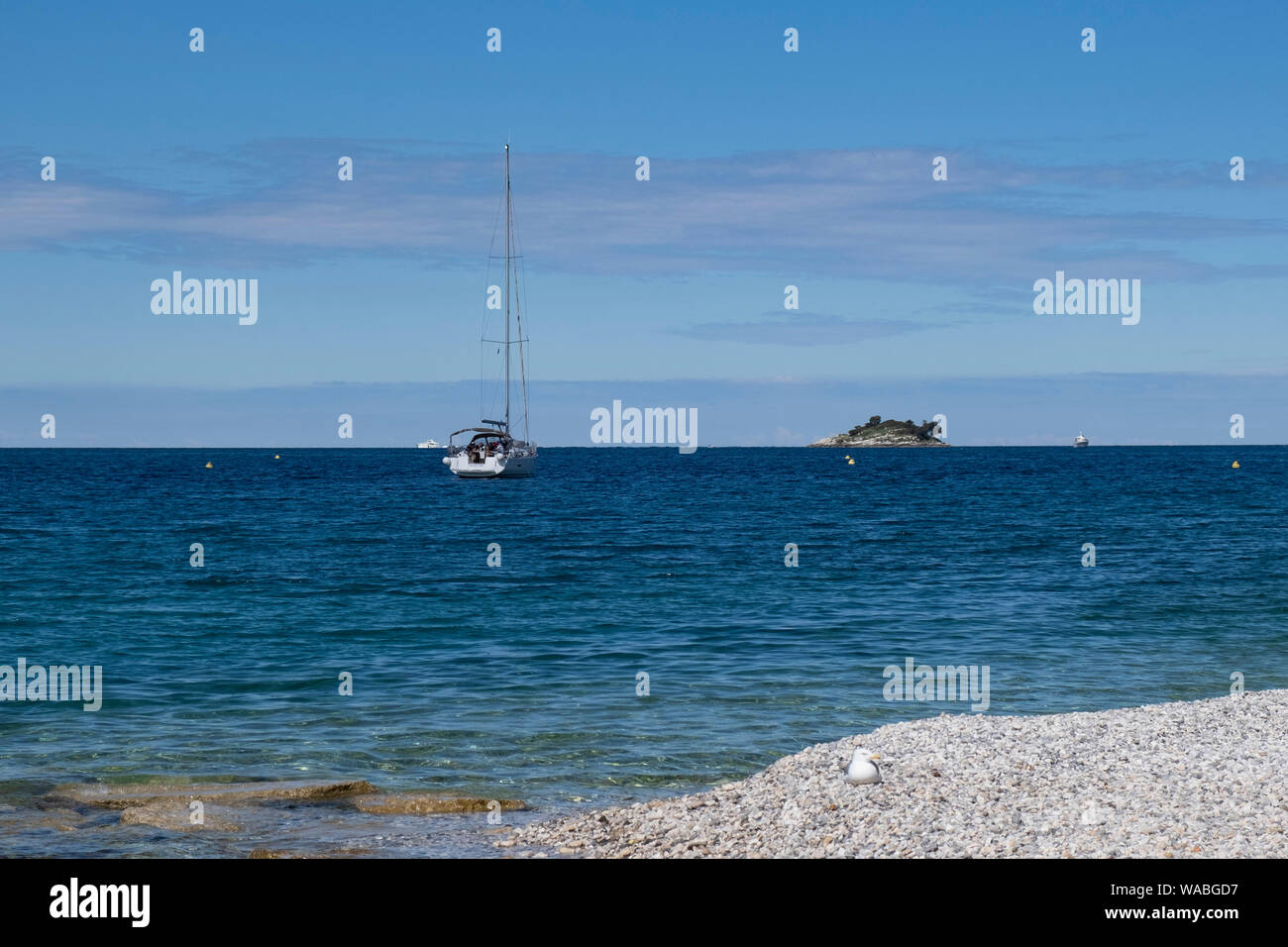 Yacht moving in sea near small island, Rovinj, Istria, Croatia Stock ...