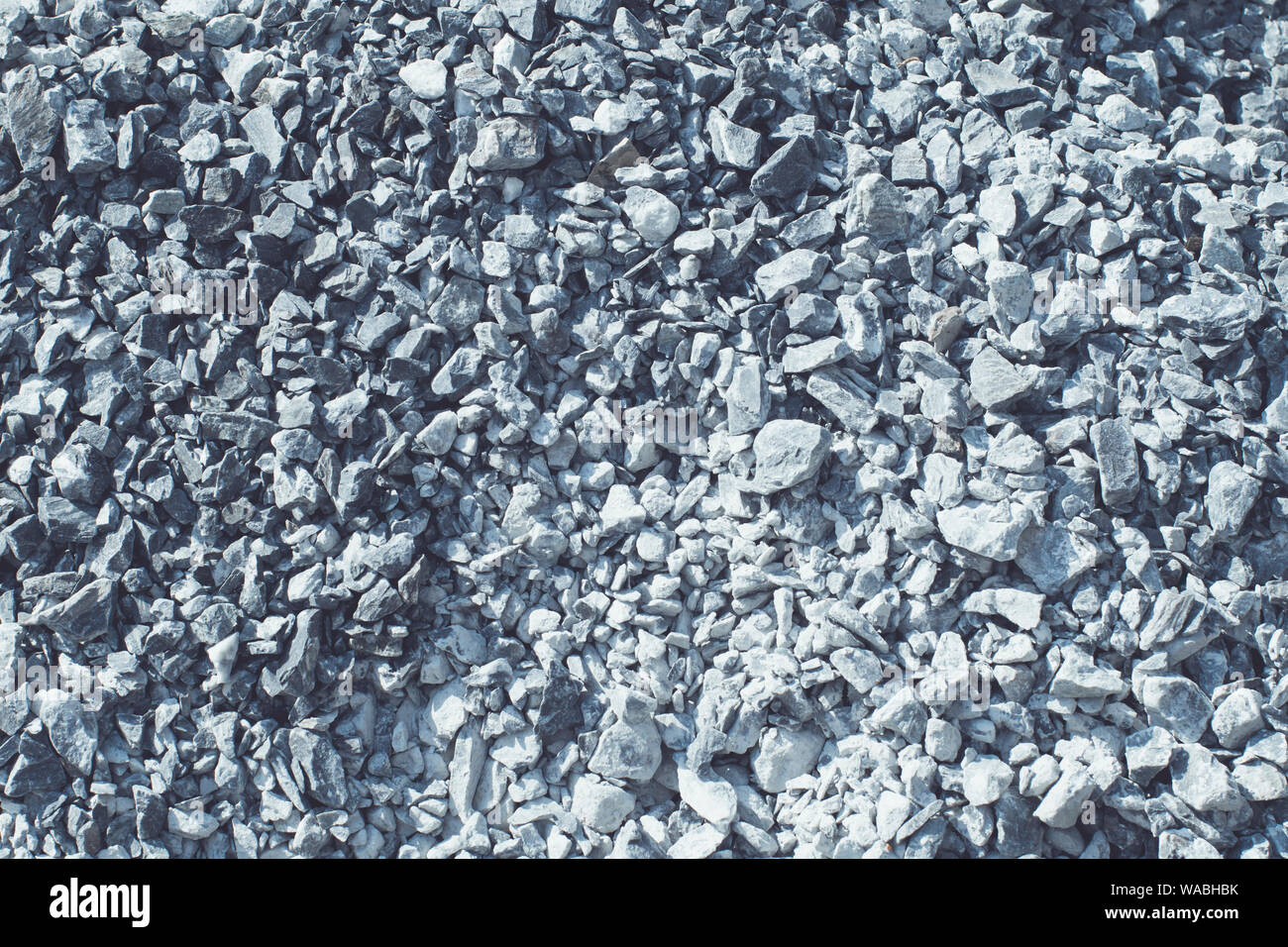 small basalt stones stack background Stock Photo - Alamy
