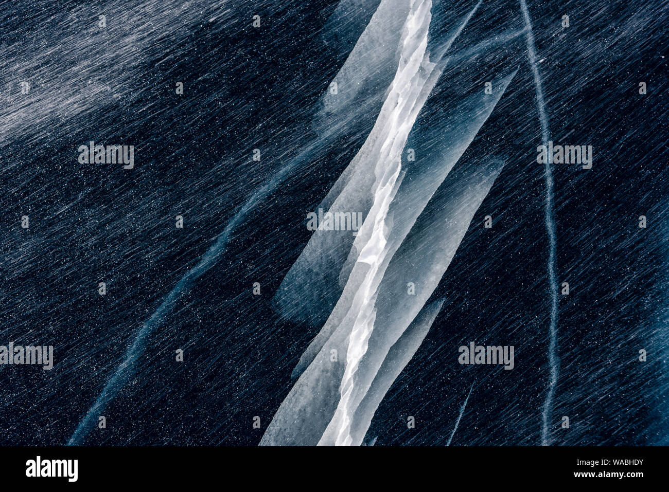 Blue cracked surface of the ice surface Stock Photo - Alamy