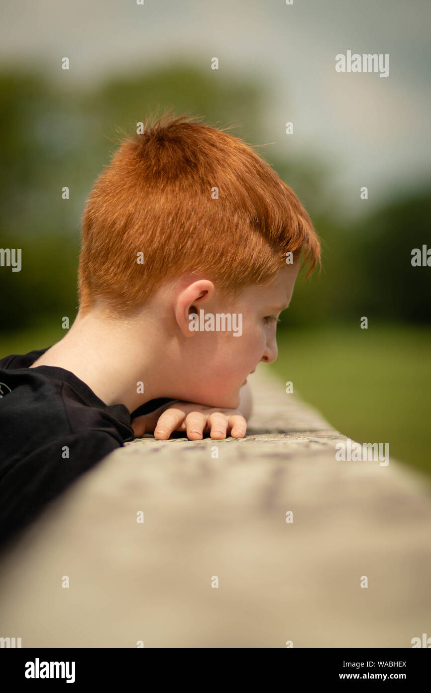 Young man in thought Stock Photo - Alamy